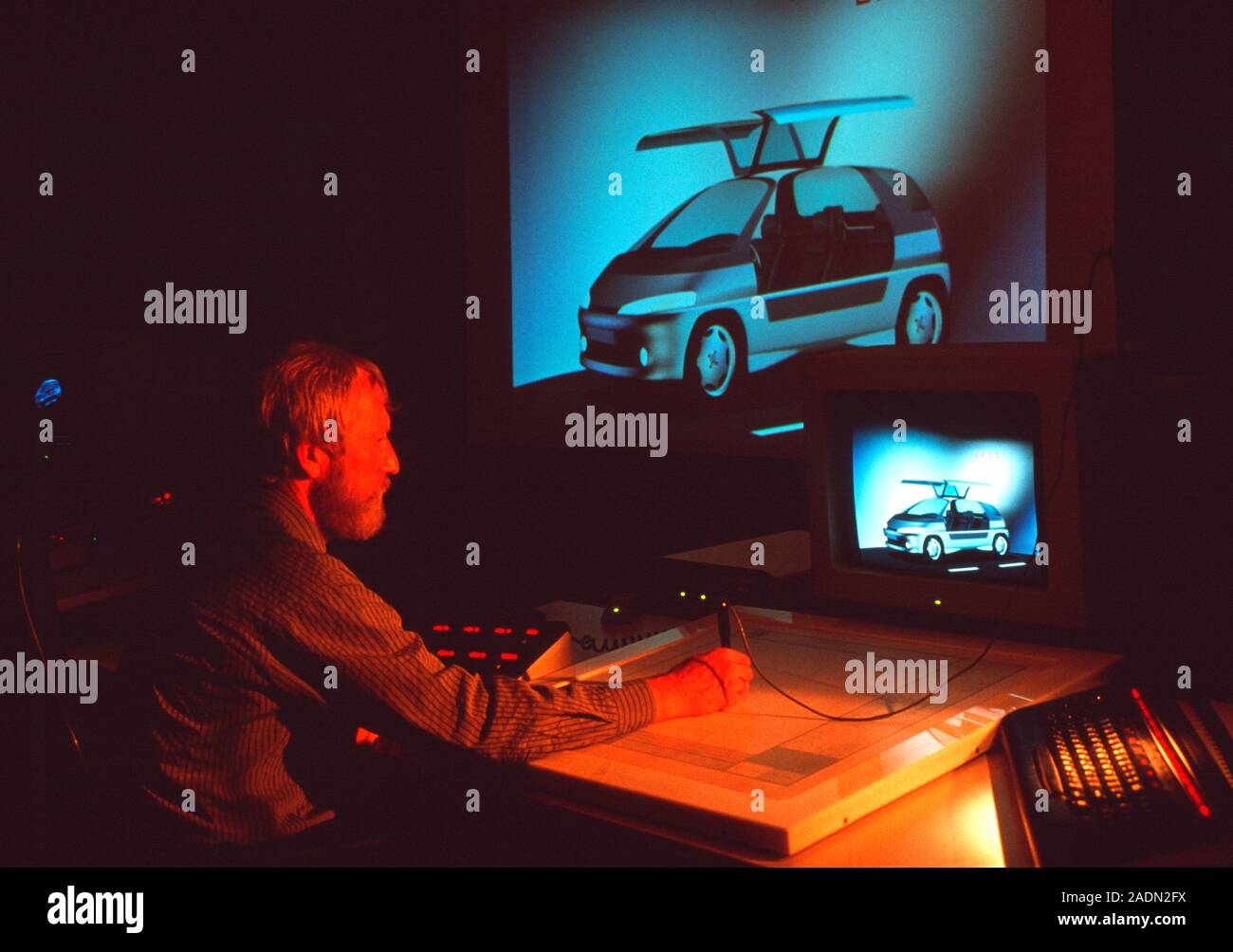 Car design. Computer-aided design (CAD) of a car which is displayed on ...