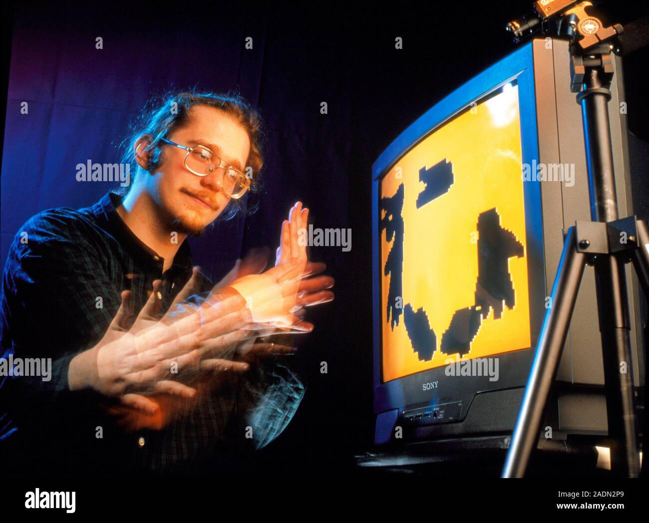 Sign language recognition. Time- exposure image of a man using a ...
