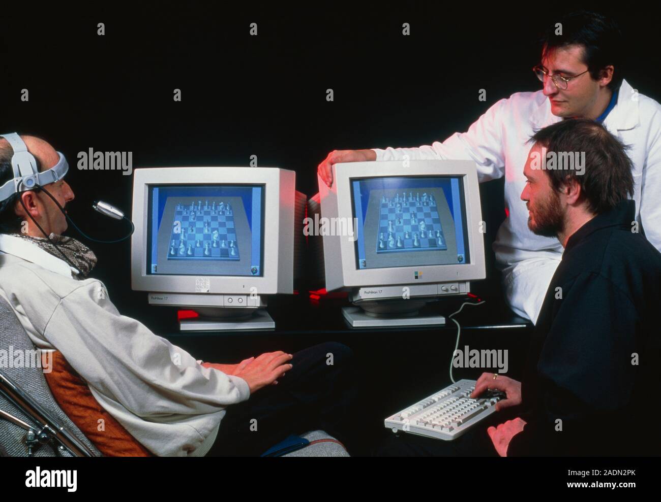 Interactive computer. Researchers playing a game of chess on an ...