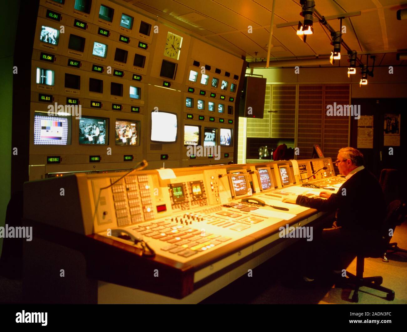 Television control room. Technician sits in a television station's ...