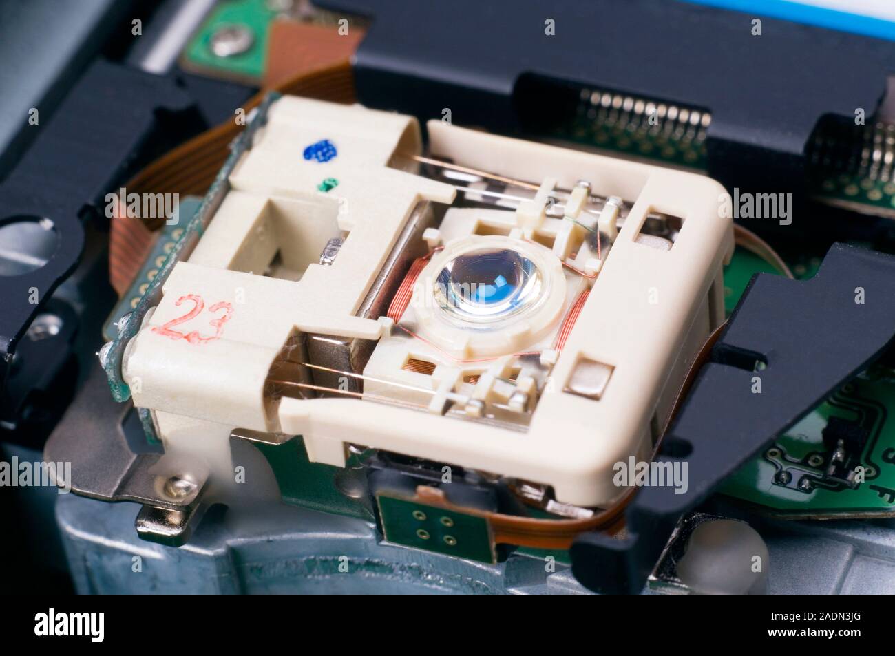 DVD-burning mechanism. The cover has been removed to reveal the ...