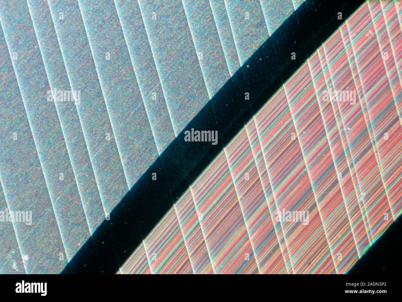 Light micrograph of a compact disc showing the diffraction of light ...