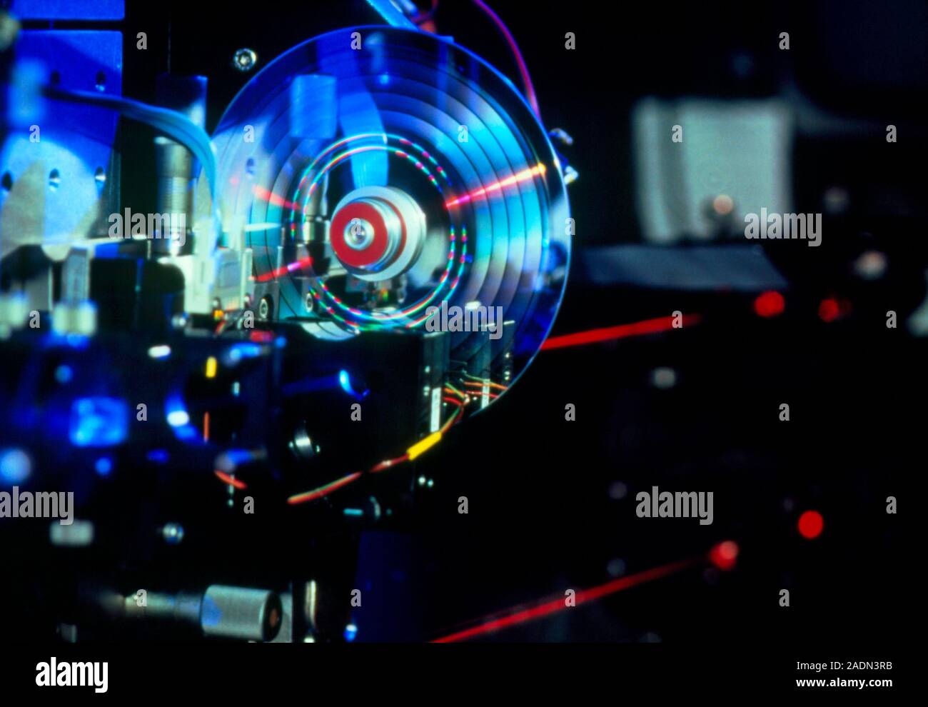 Compact disc manufacture. A compact disc master being 'written' upon by ...