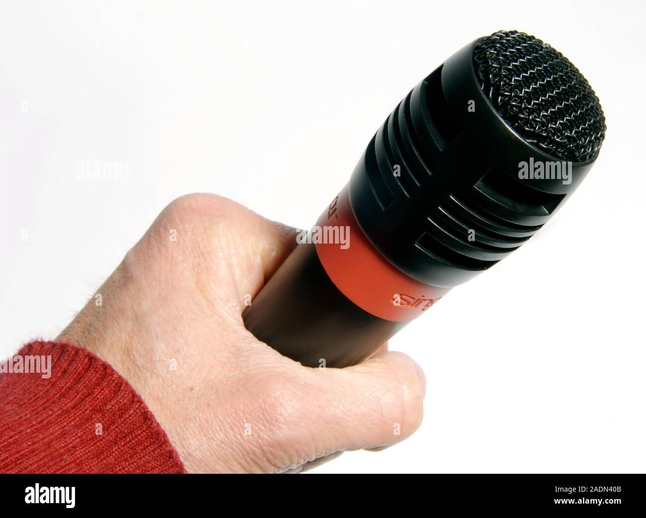 Microphone being held in a hand Stock Photo - Alamy