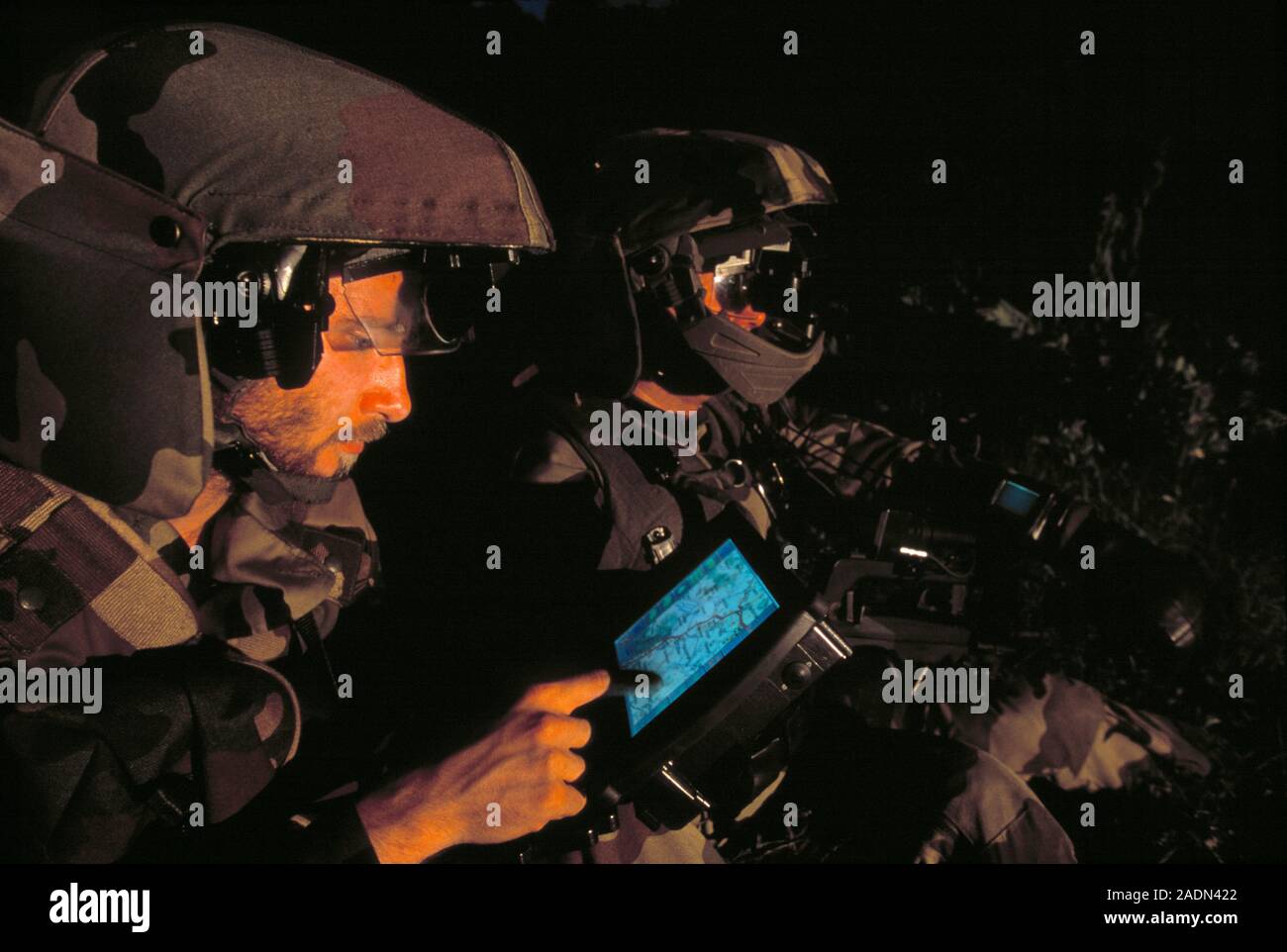 Soldiers using global positioning system (GPS) equipment. GPS relies on ...