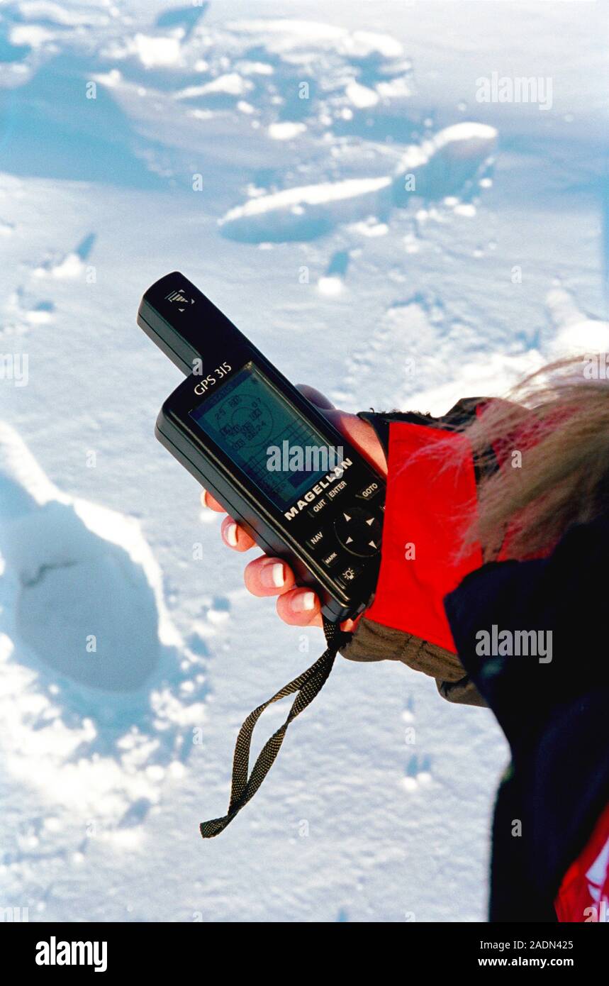 Global positioning system (GPS) receiver held in a hand. 24 GPS ...