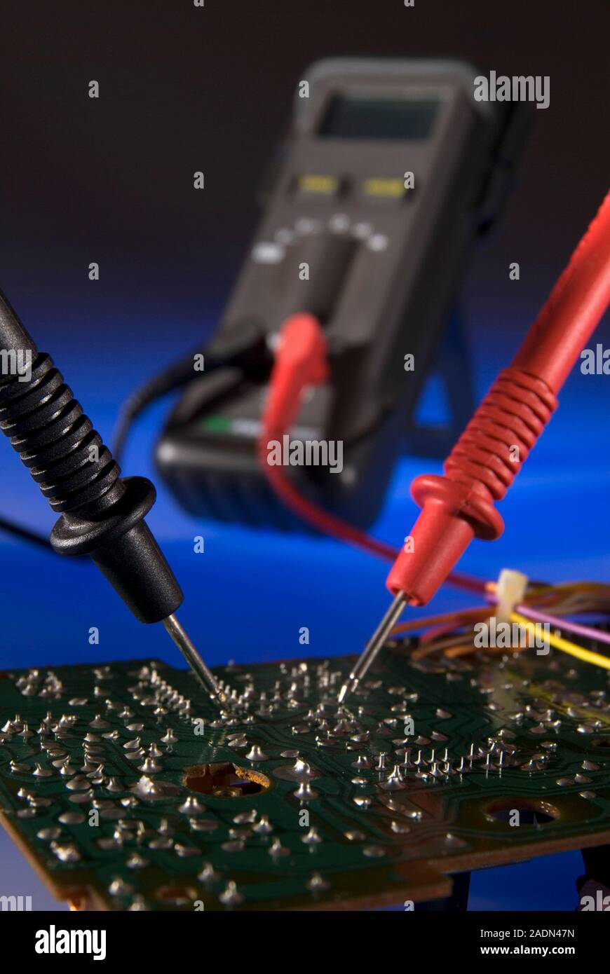Digital multimeter being used to test the electrical resistance across ...