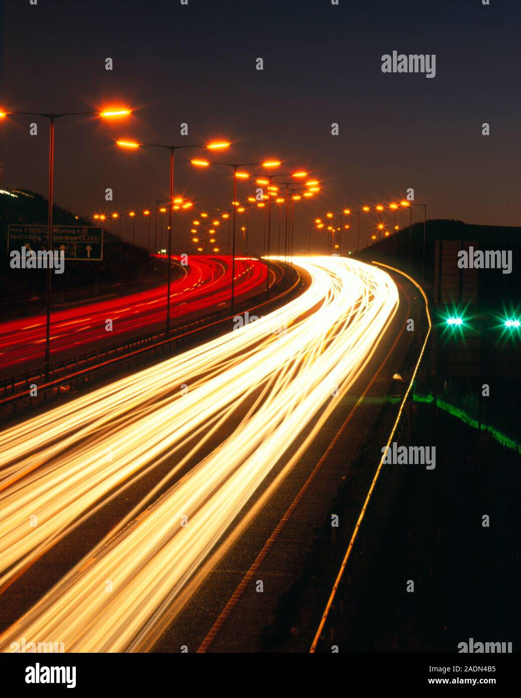 Motorway at night. Time exposure photograph of car lights on a motorway ...