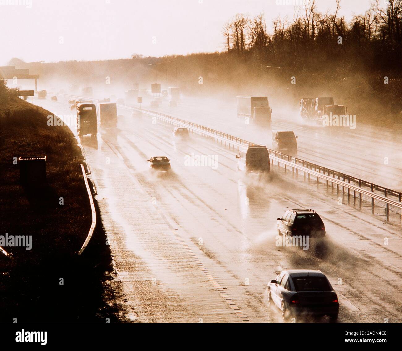 Traffic on wet motorway. Vehicles driving on a wet motorway after a ...
