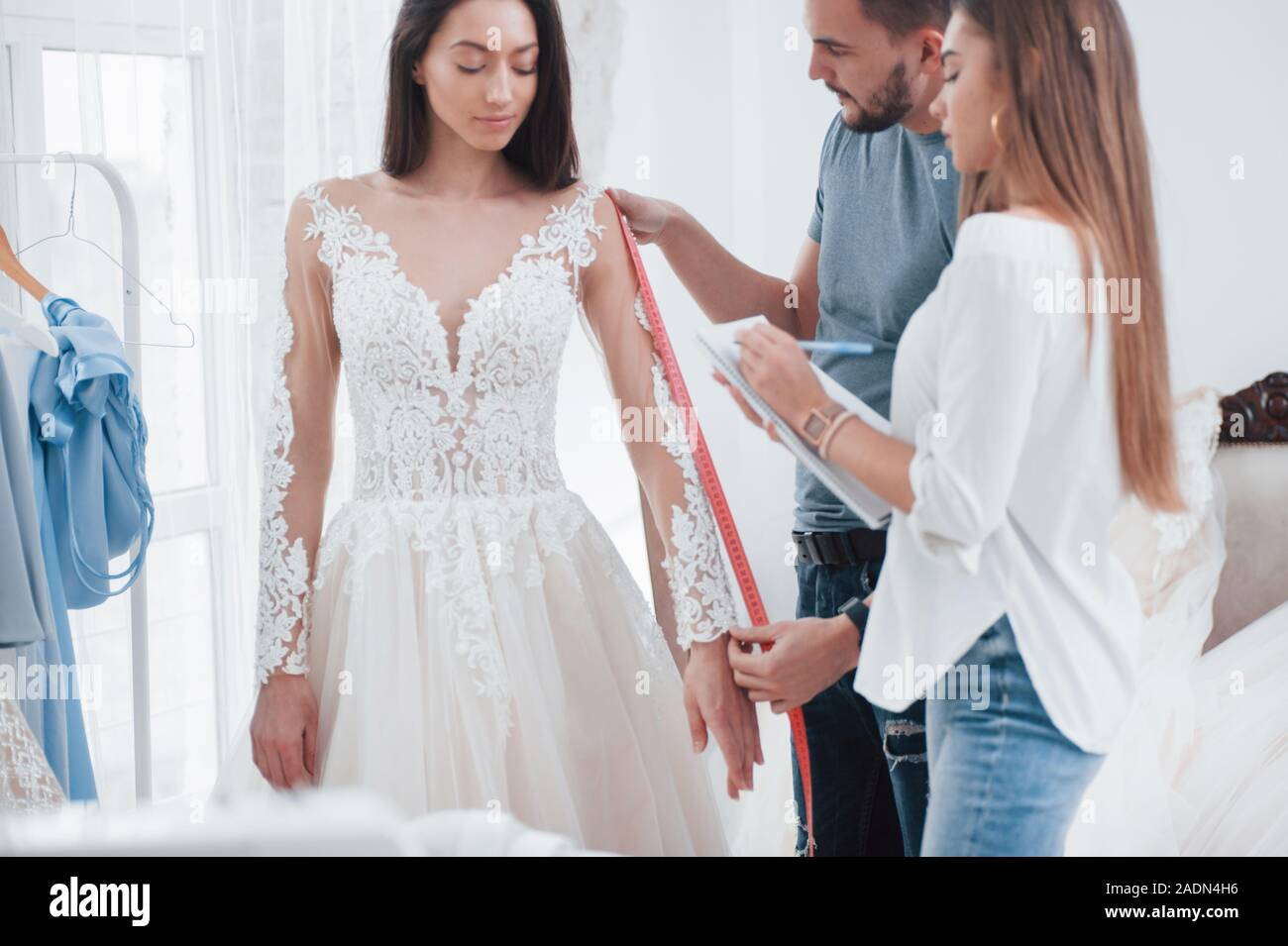 Almost prepared for the wedding. The process of fitting the dress in ...