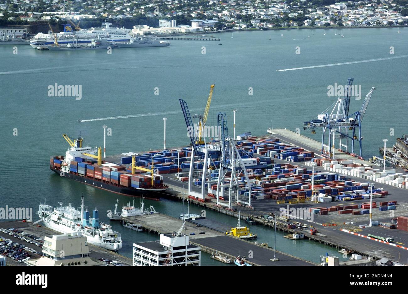 Container ship in a harbour. The containers are the large rectangular ...