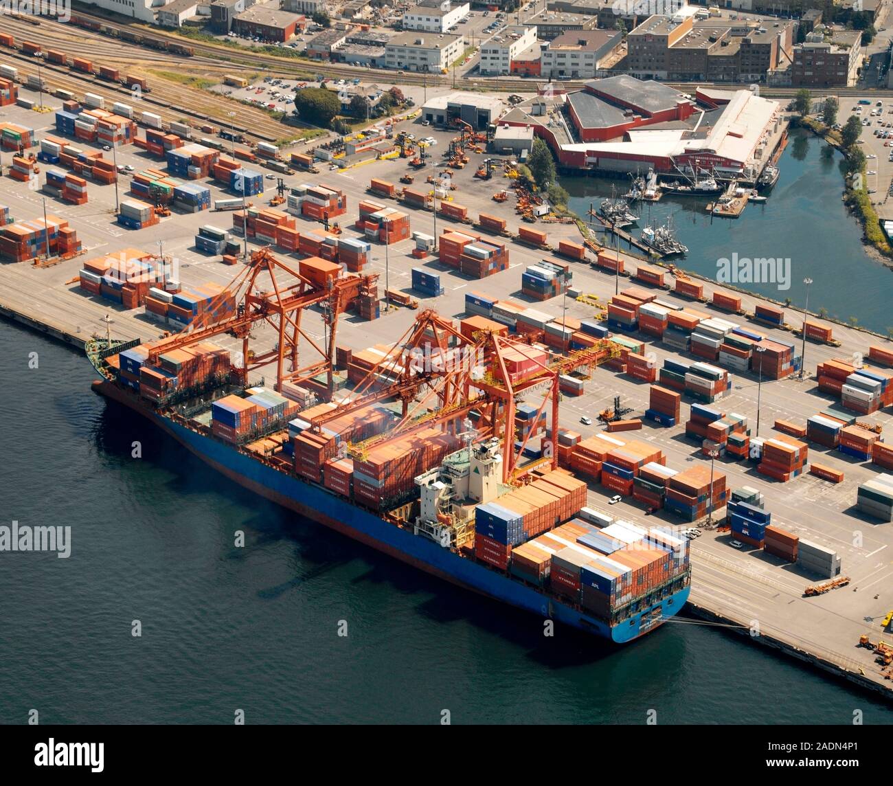 Container ship and cranes. Aerial view of a container port and ship ...