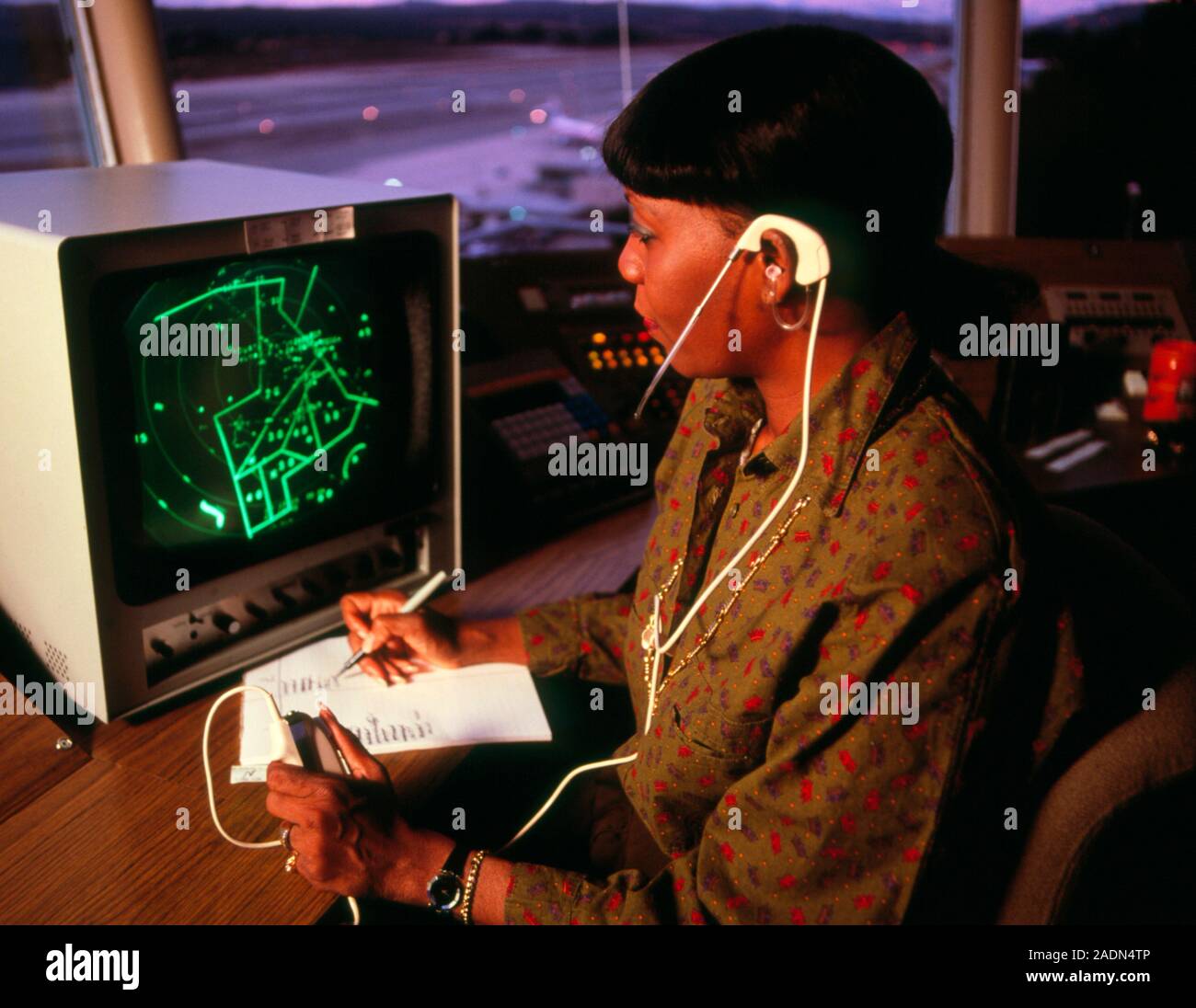 Air traffic control. Woman working in an air traffic control (ATC ...