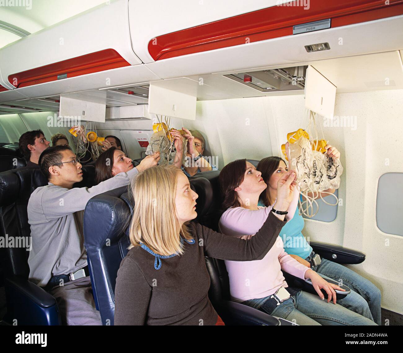 Airliner oxygen masks. Passengers on a commercial passenger jet ...