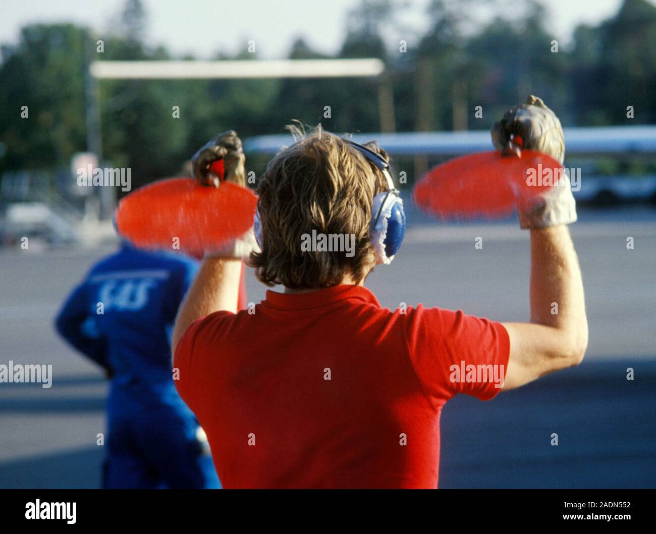 Aircraft marshalling. Aircraft marshall using visual signals at an ...