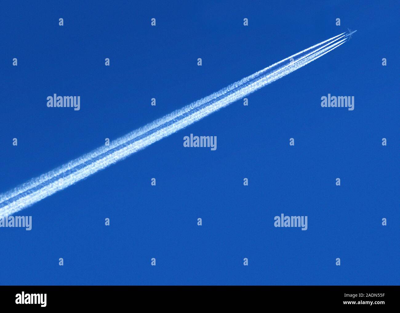 Aeroplane contrail. Aeroplane, at a height of 10 kilometres, producing ...