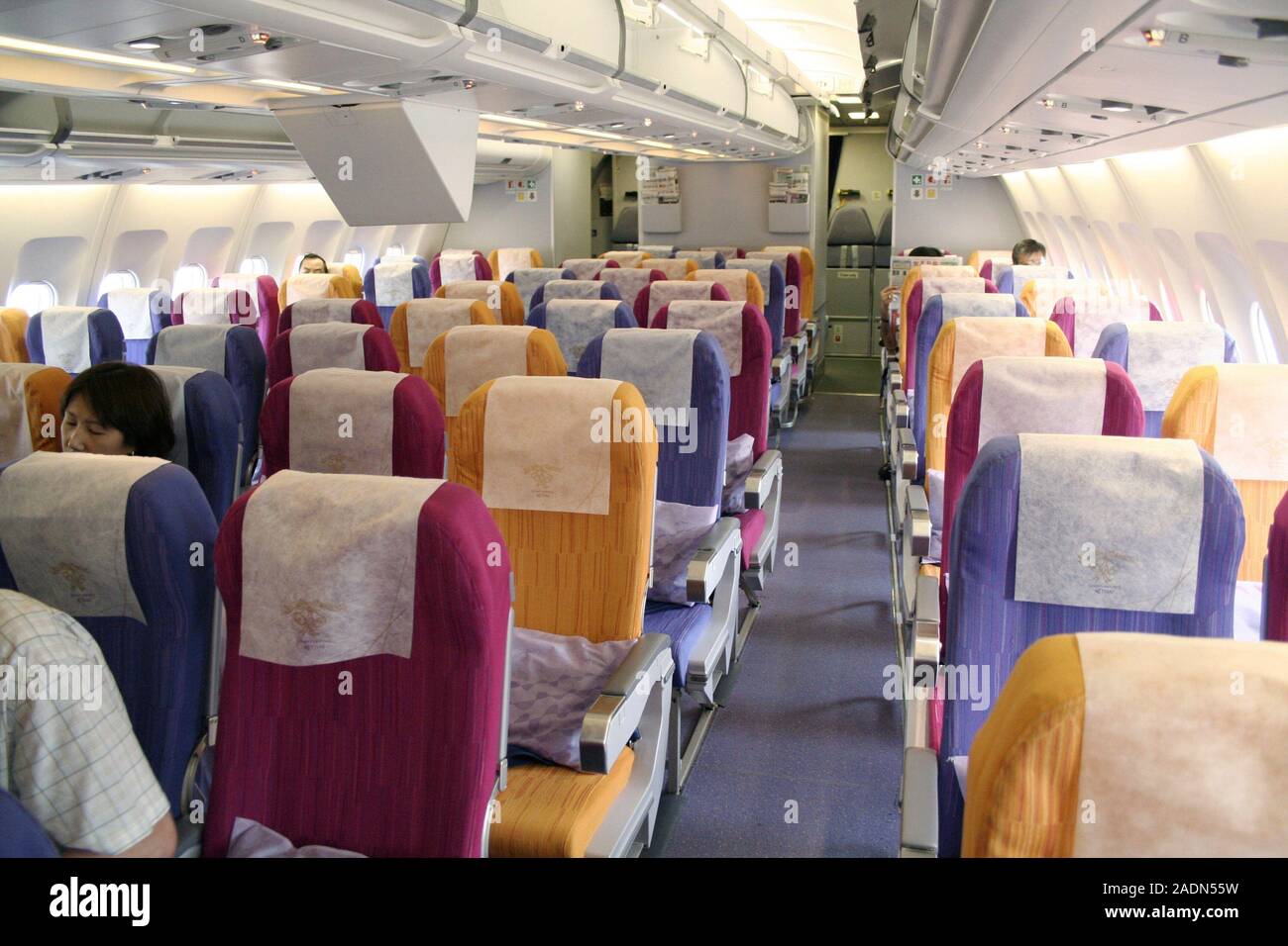 Aeroplane seating. People in their seats during a flight Stock Photo ...