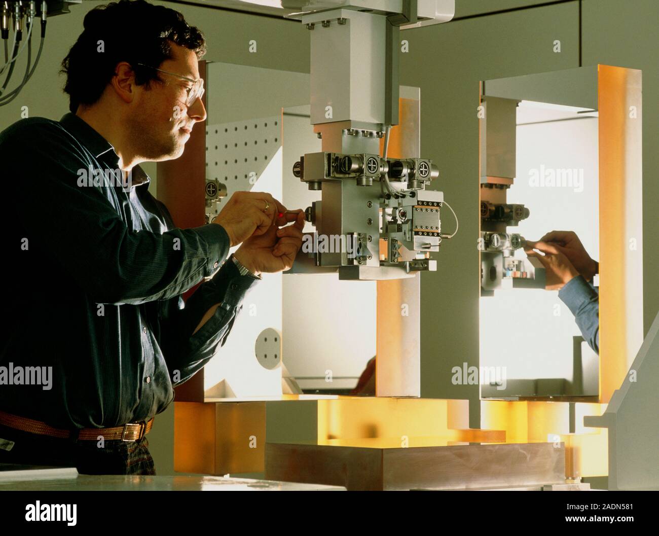 Space component measurement. Male technician working at a computer ...