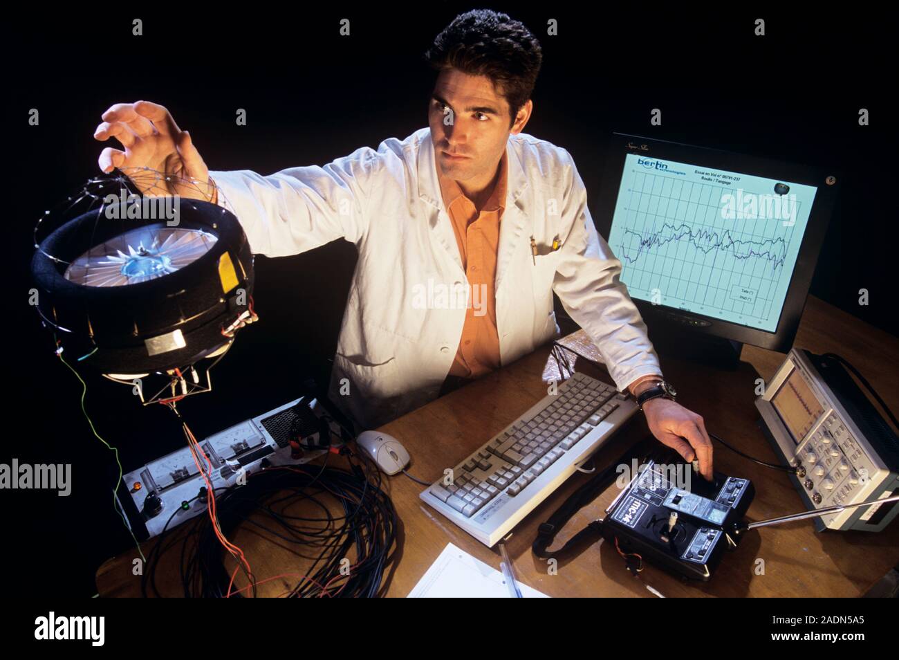 Unmanned aerial vehicle (UAV) research. Researcher reaches towards a ...