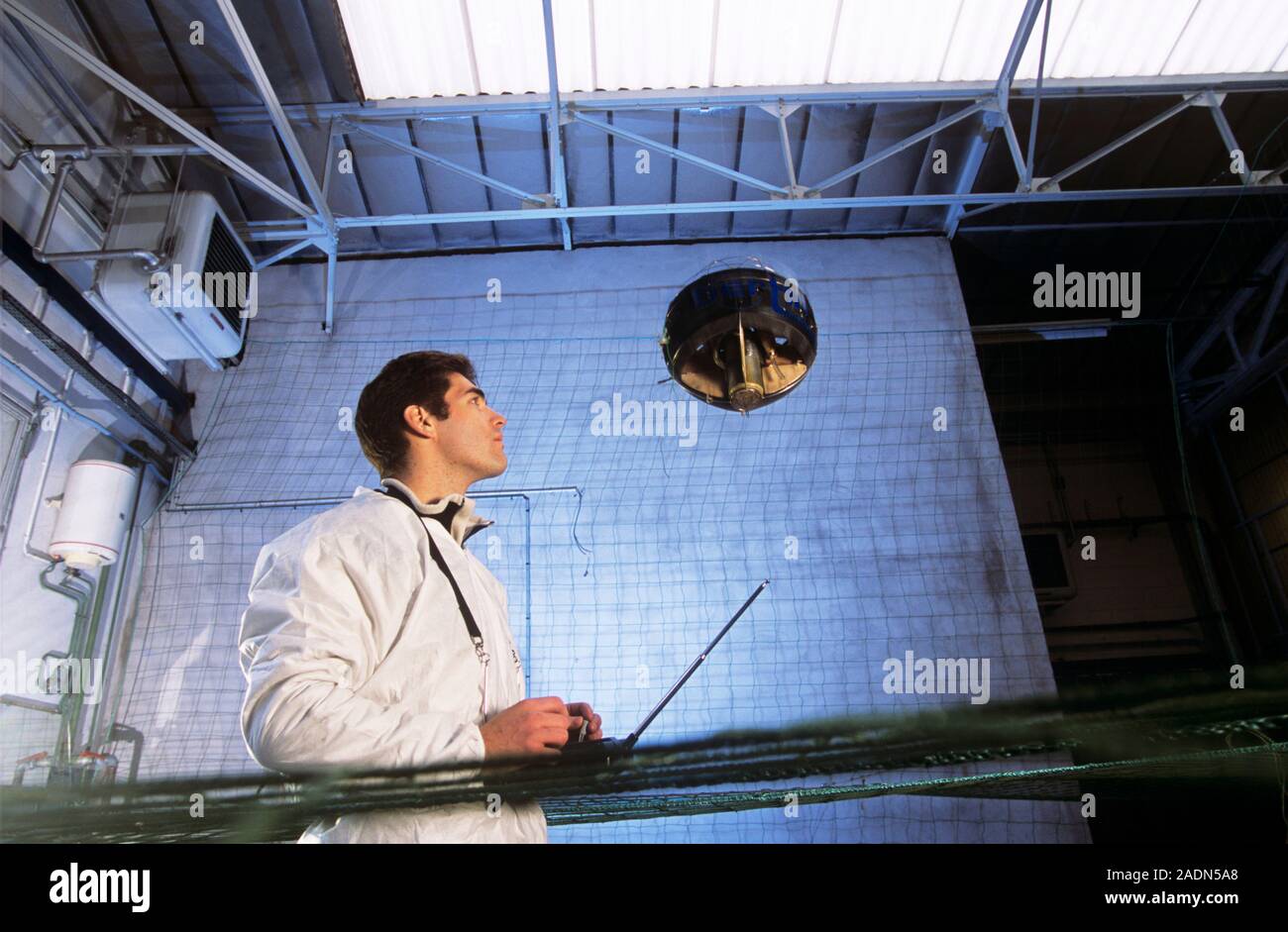 Unmanned aerial vehicle (UAV) research. Researcher controls a flying ...