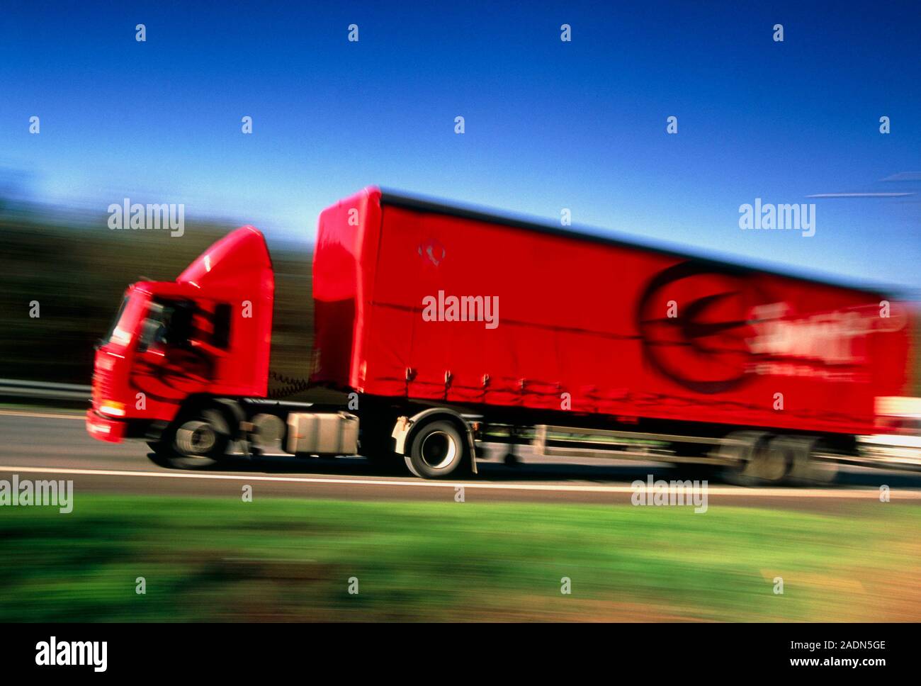 Lorry. Time-exposure image of an articulated lorry on a motorway. Heavy ...