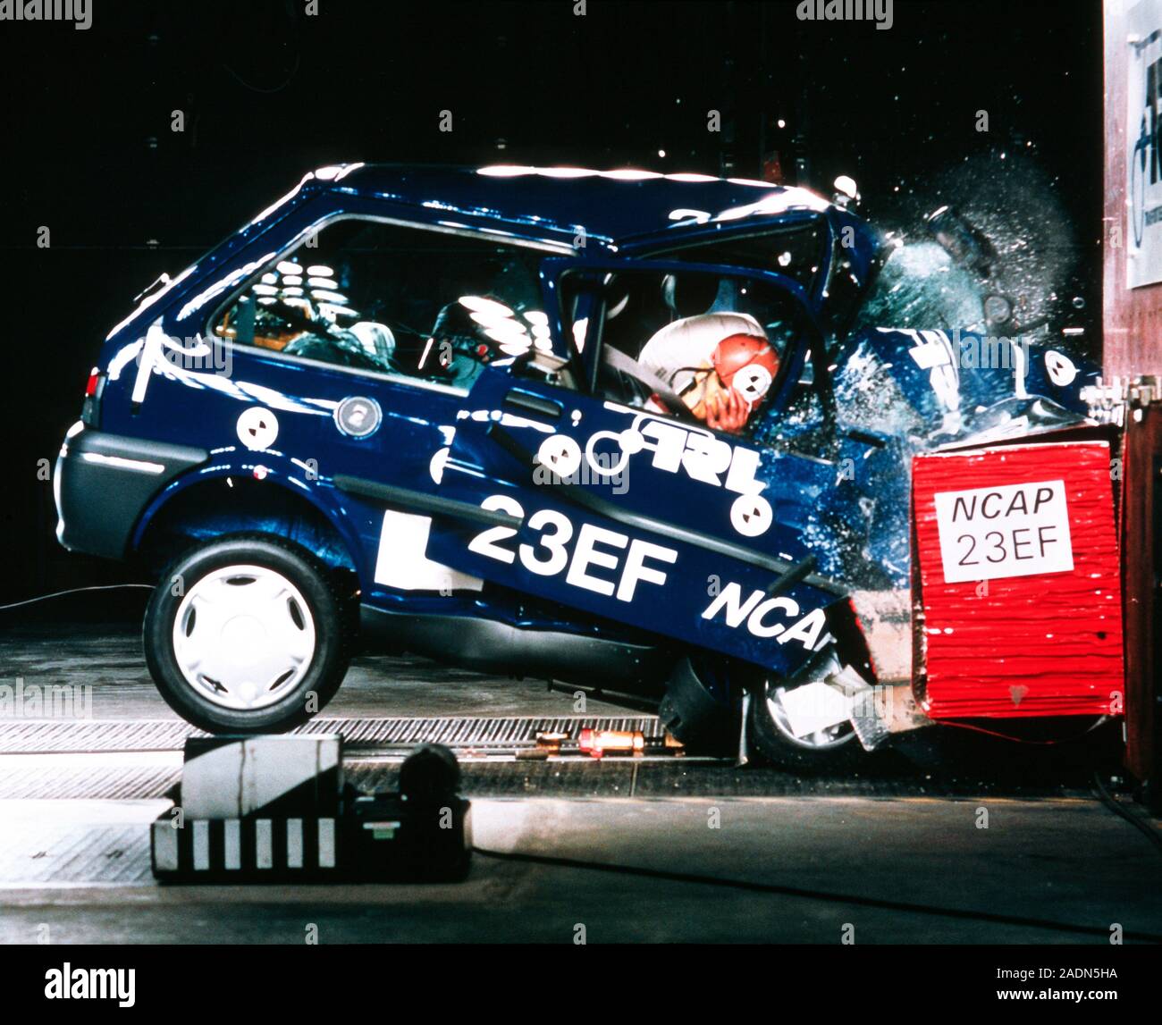 Crash testing. High-speed photograph of a Hybrid III crash test dummy ...