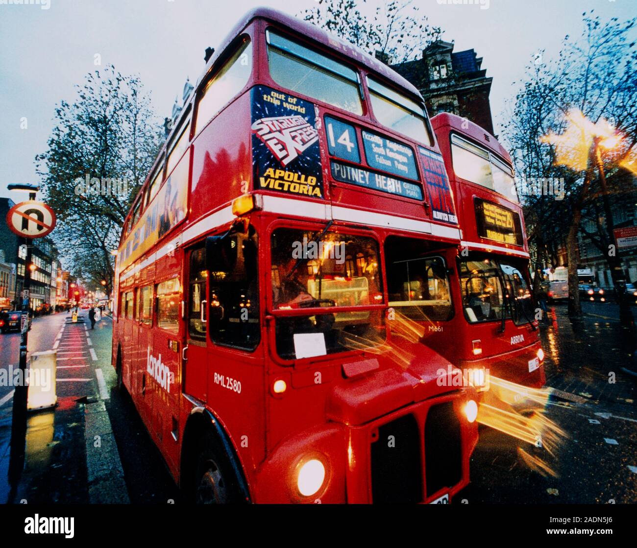London buses. Time-exposure image of two Routemaster buses on a street ...