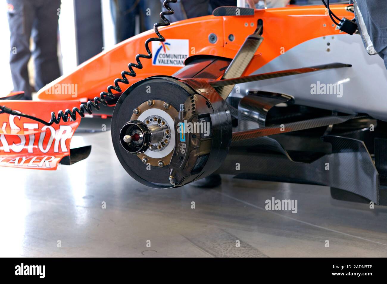 Racing car wheel hub. Exposed front wheel hub of a Formula One racing ...
