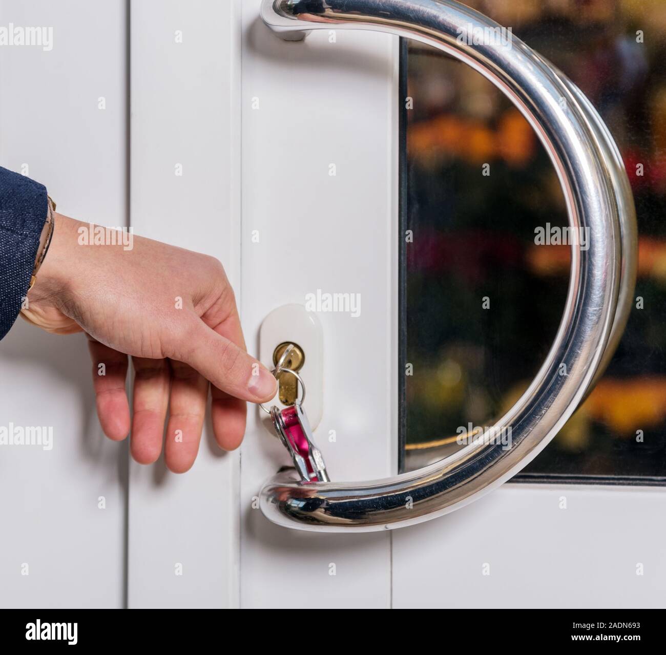 Man opening the door with a key Stock Photo - Alamy
