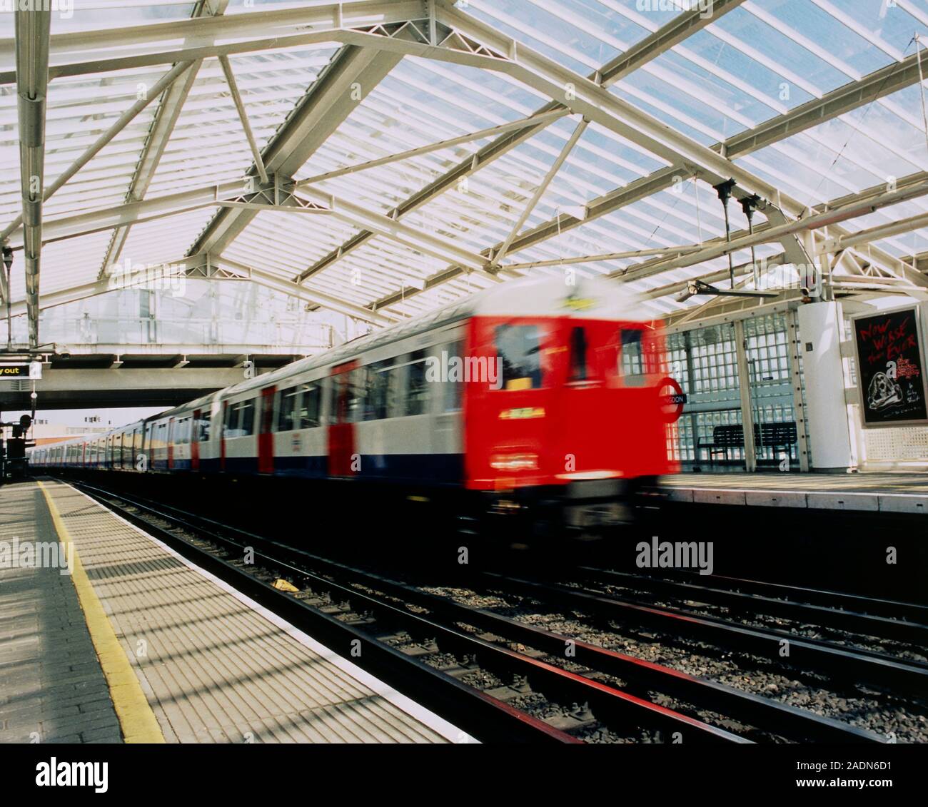 Moving tube train. Time-exposure image of a moving tube train at ...