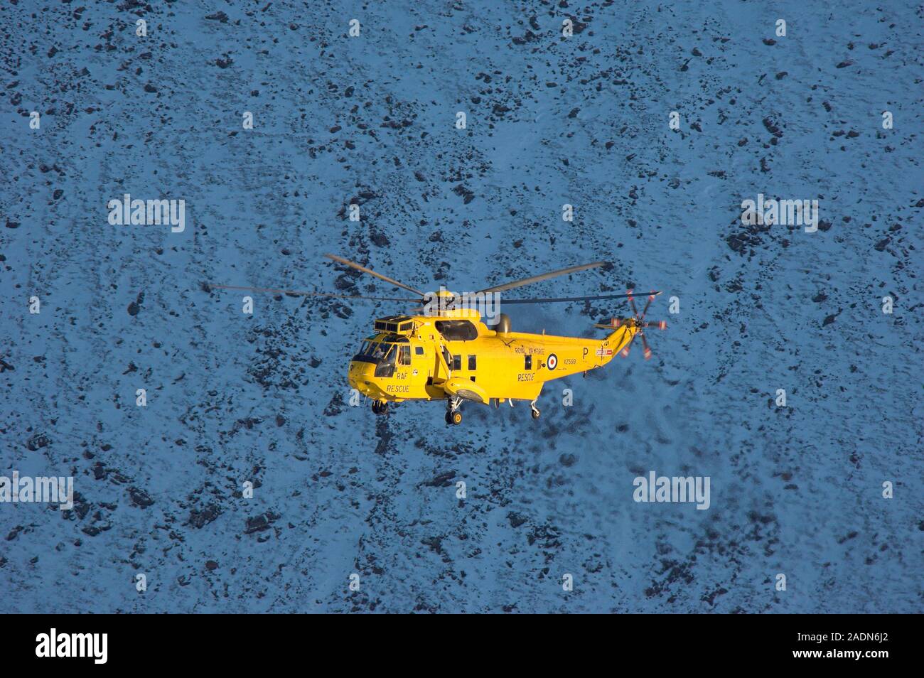Mountain rescue. RAF rescue helicopter during an operation in the Cairngorms mountain range ...