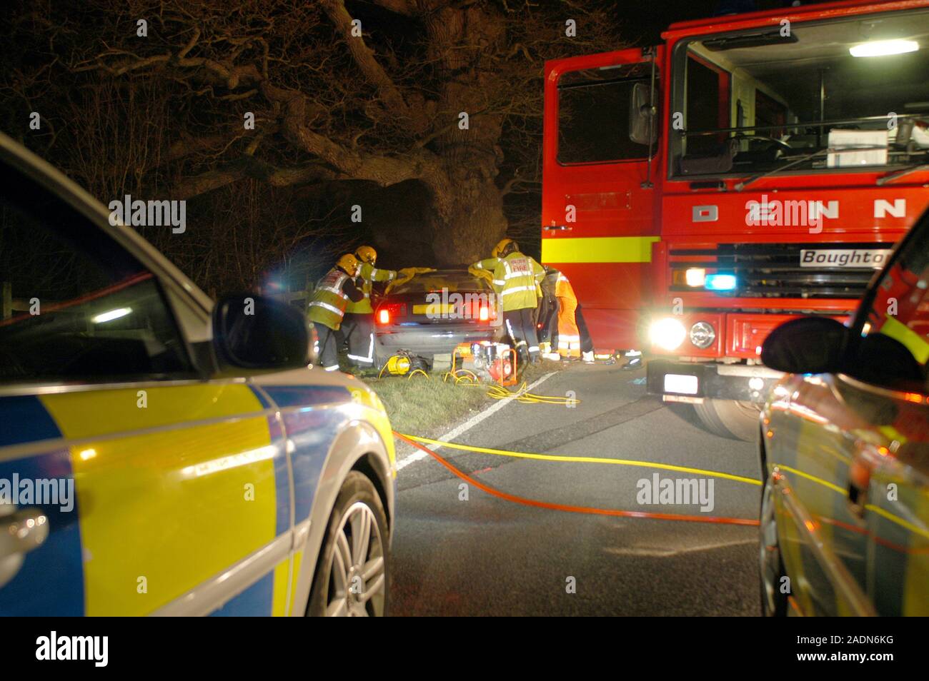 MODEL RELEASED. Road traffic accident. Firefighters rescuing people ...