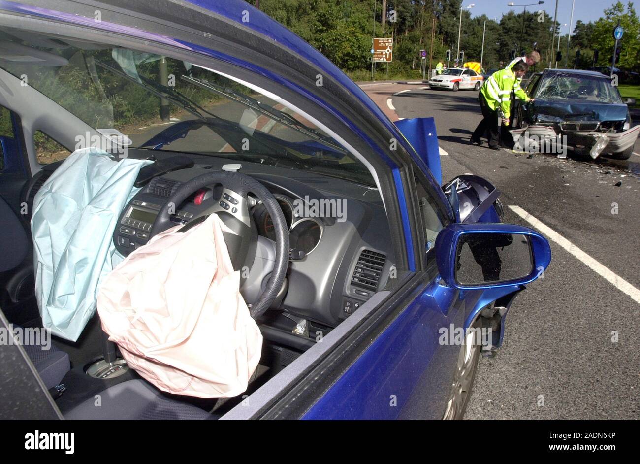 MODEL RELEASED. Road traffic accident. Crash investigators at the scene ...
