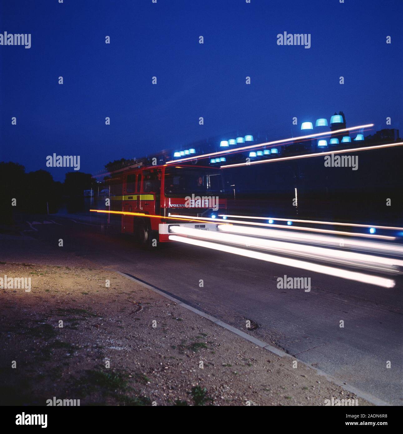 Fire engine. Time exposure image of a fire engine with flashing blue ...