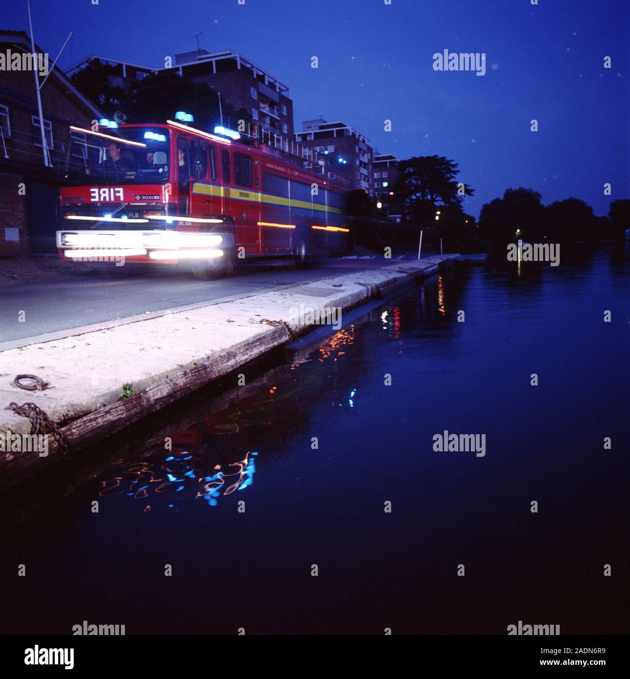 Fire engine. Time exposure image of a fire engine with flashing blue ...