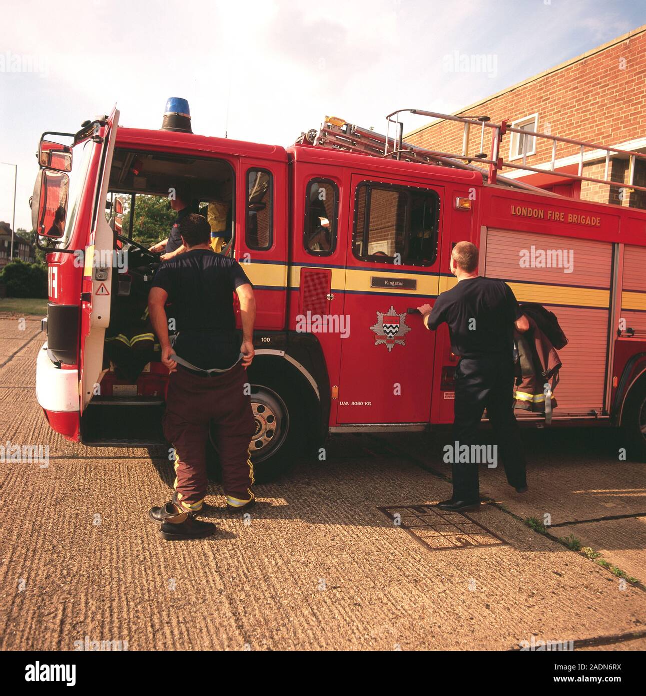 Fire engine at a fire station with its crew. Photographed in London ...