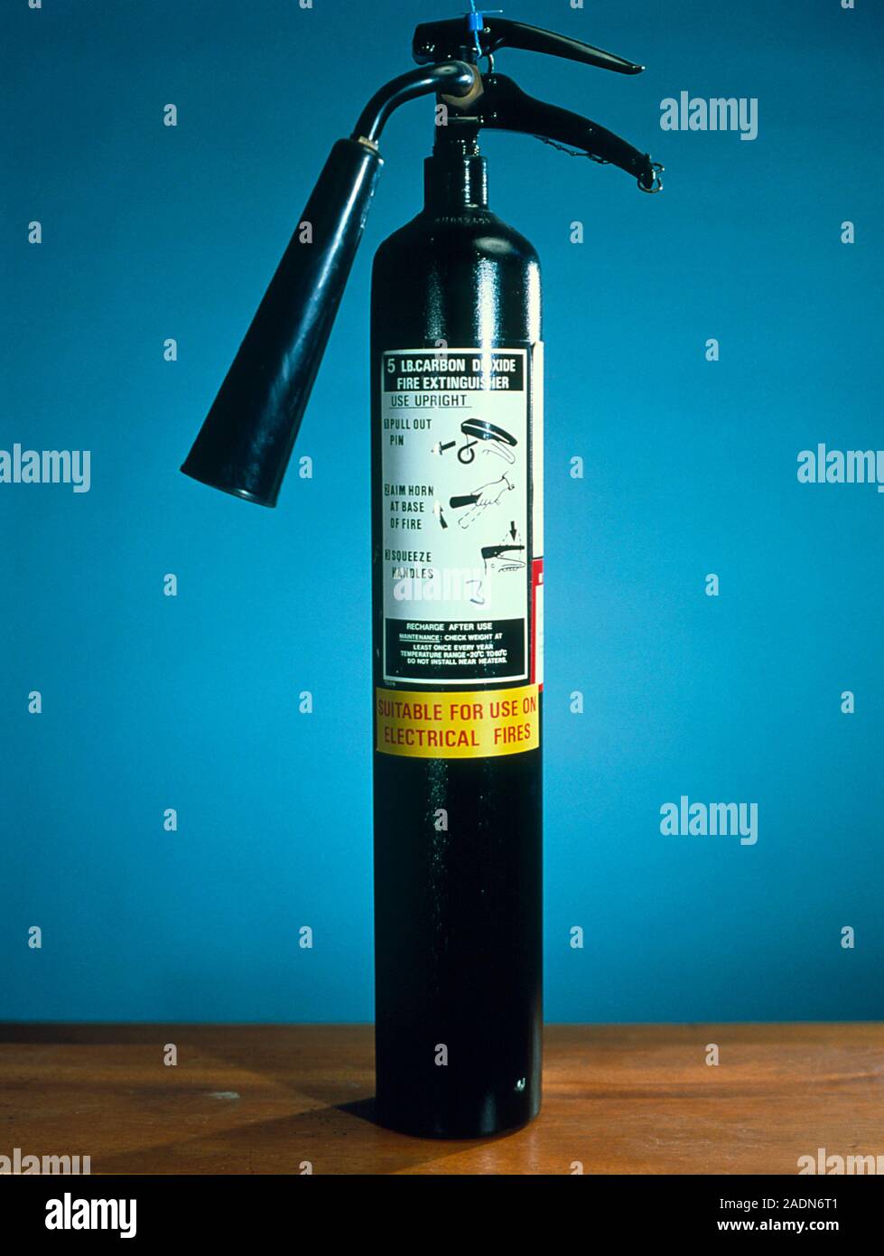 Carbon dioxide fire extinguisher. Pressurized canister containing ...