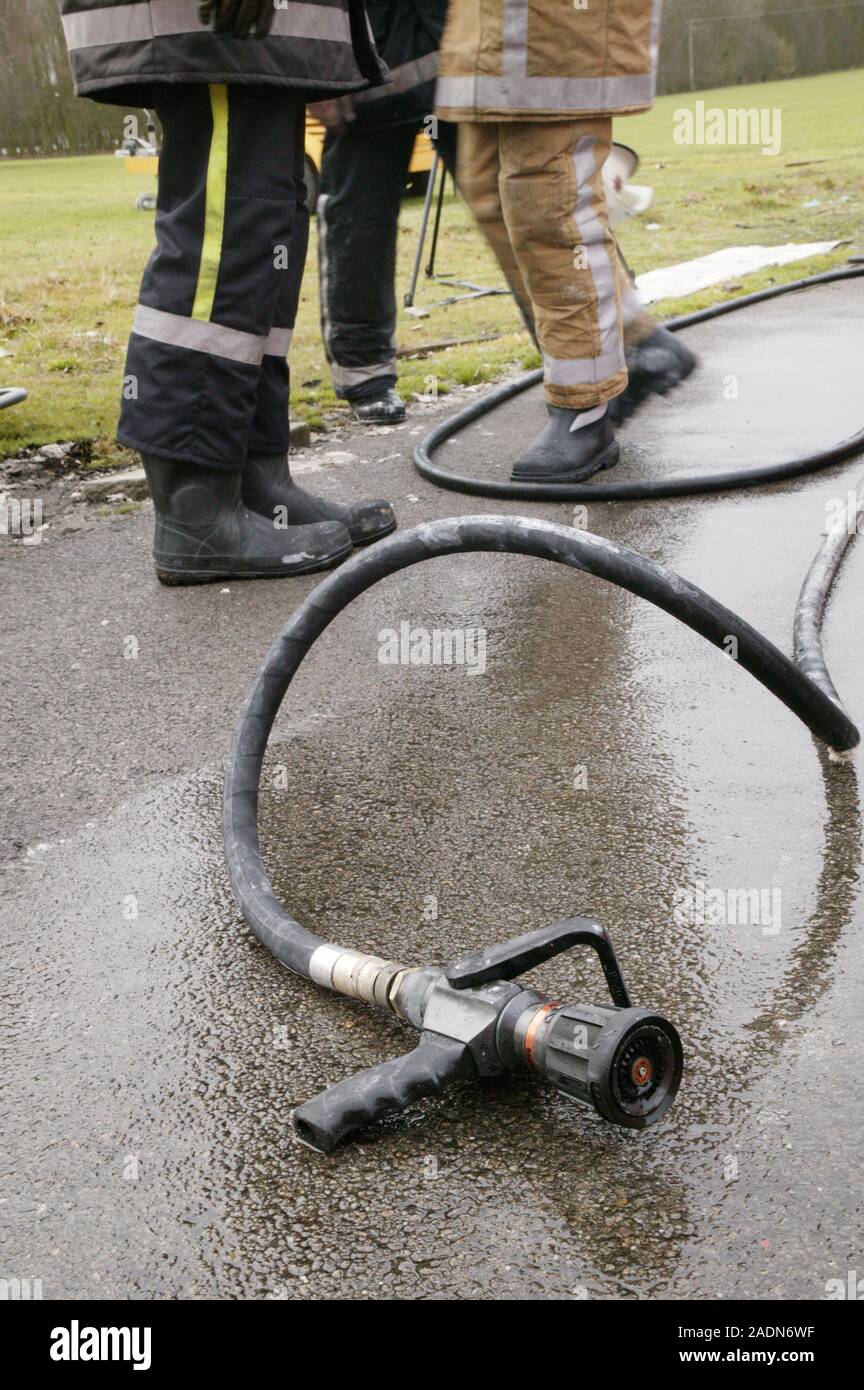 Firefighters' hose. The high-pressure hose is connected to the fire ...
