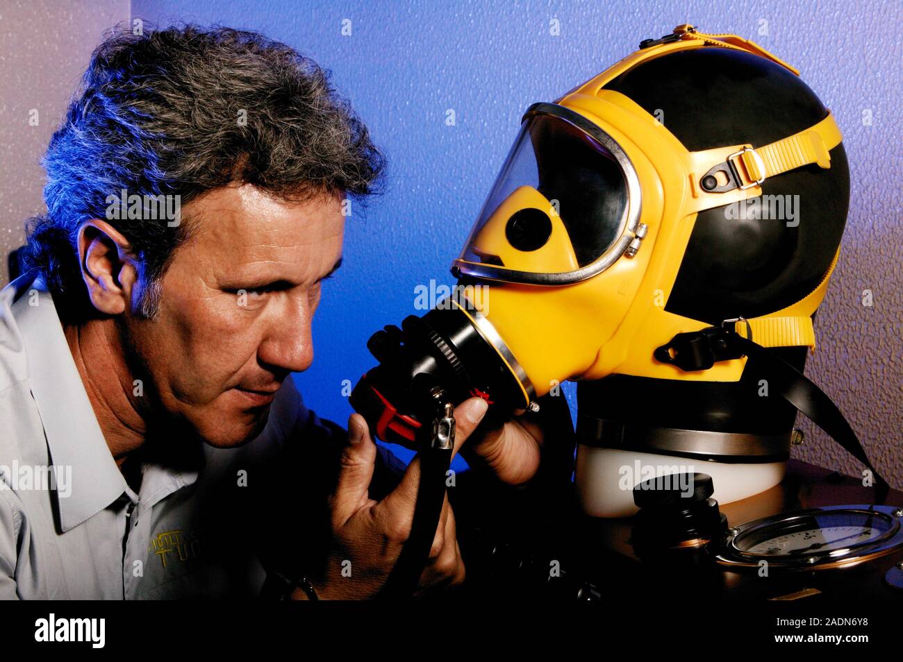 Firefighting breathing equipment. Firefighter testing the respirator on ...