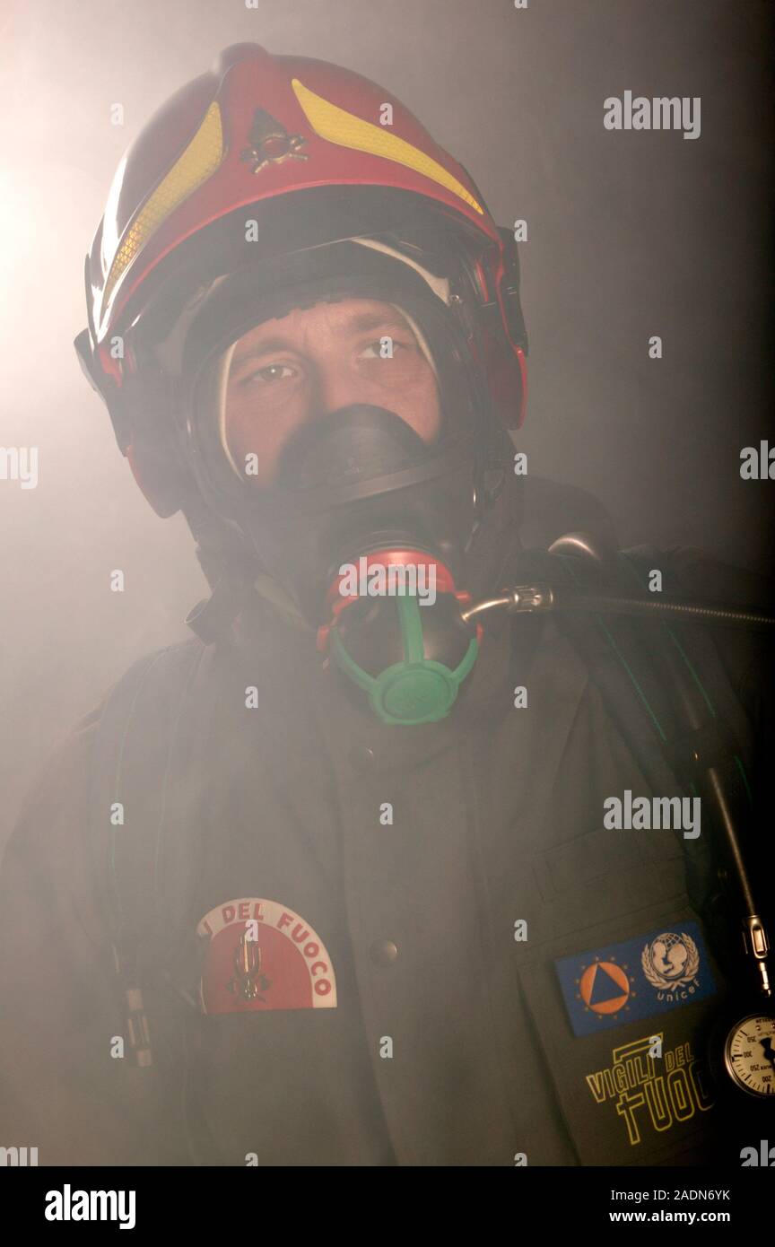 Firefighter in a smoke-filled training room Stock Photo - Alamy