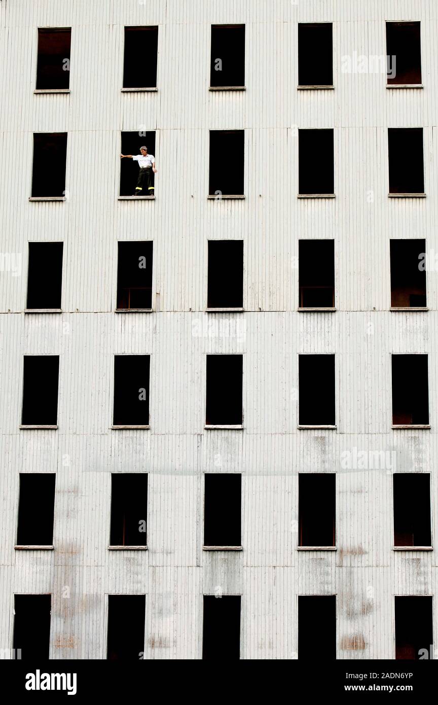 Firefighter training. Firefighter standing in the window of a training ...