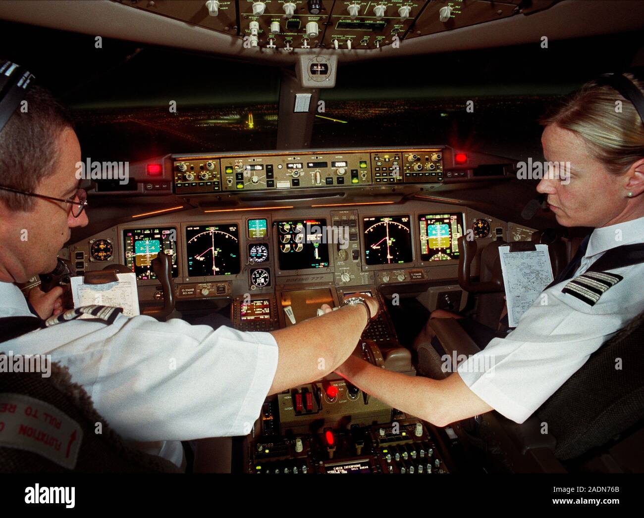 Flight simulator. Pilots during training in a Boeing 777 aircraft ...