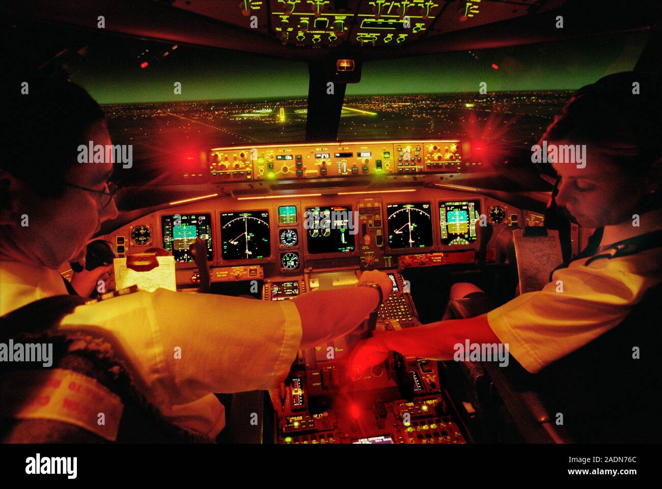 Flight simulator. Pilots during training in a Boeing 777 aircraft ...