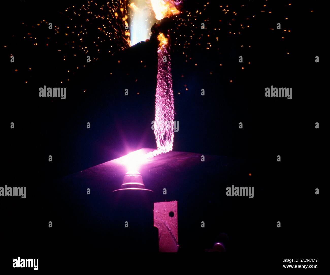 Plasma torch cutting steel. View of steel being cut by a plasma torch ...