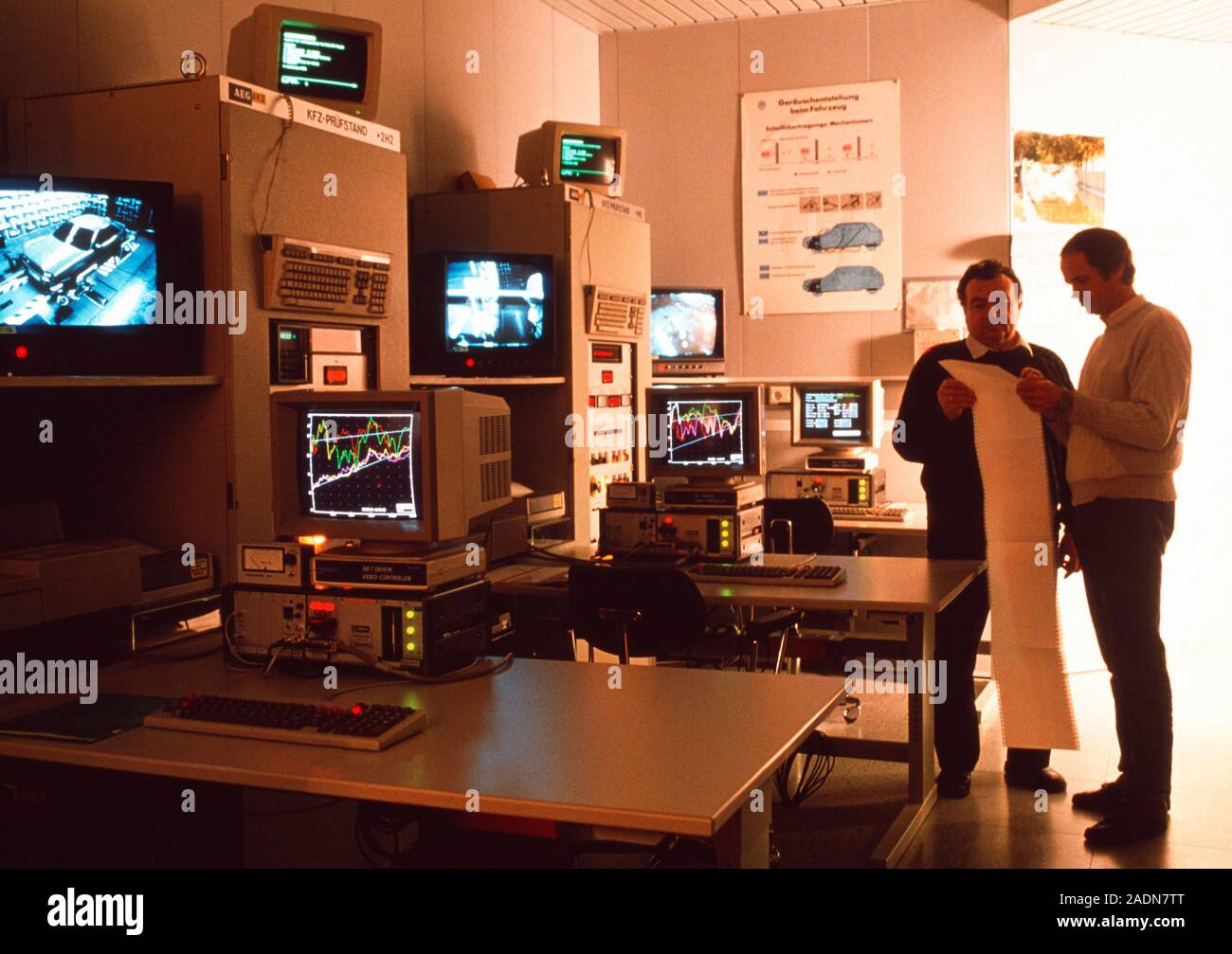 Car test results being studied by engineers. The computers and screens ...