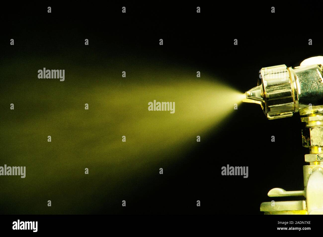 Spray gun spraying paint Stock Photo - Alamy