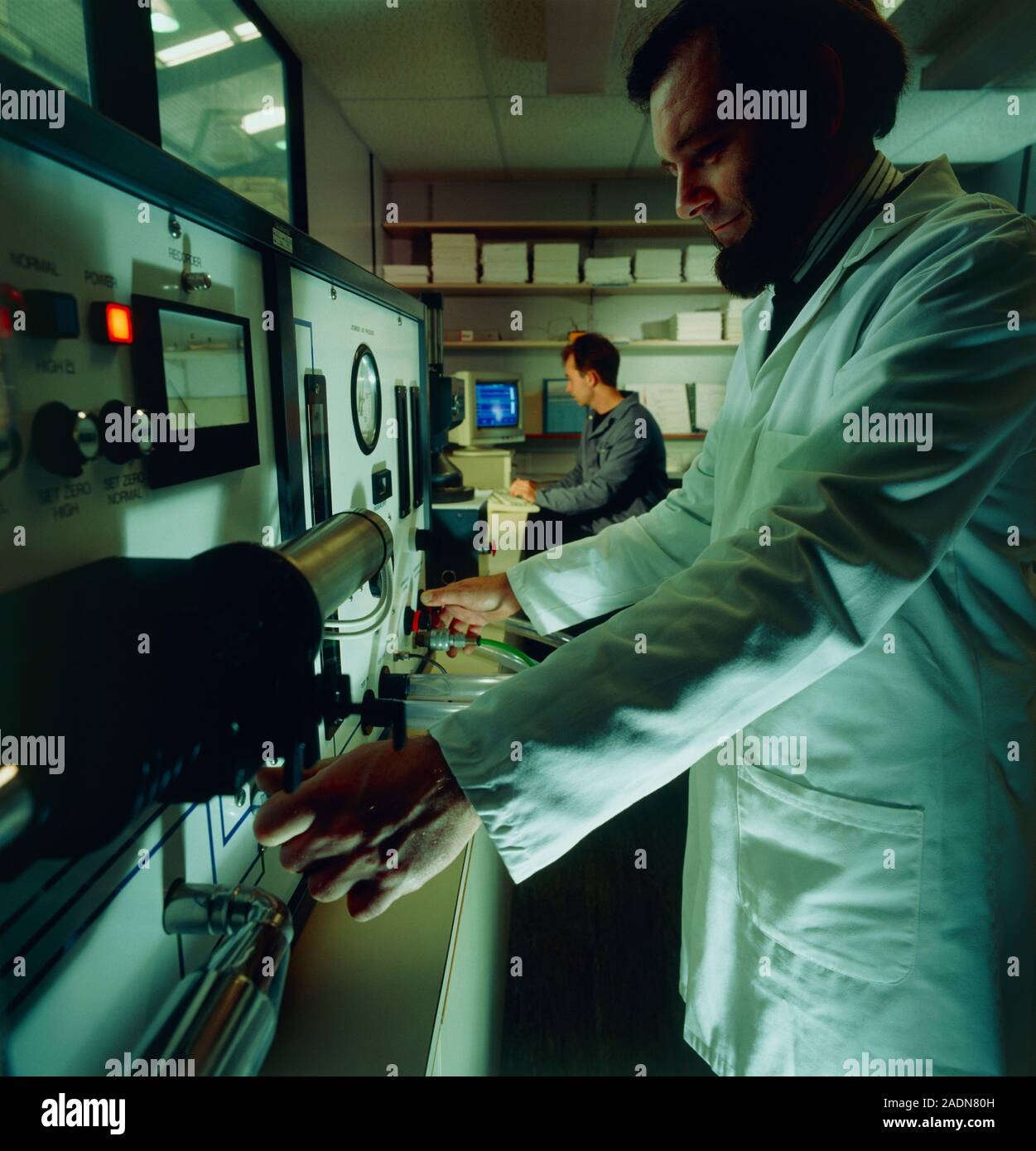 Carbon fibre testing. Technicians monitoring quality control tests on ...