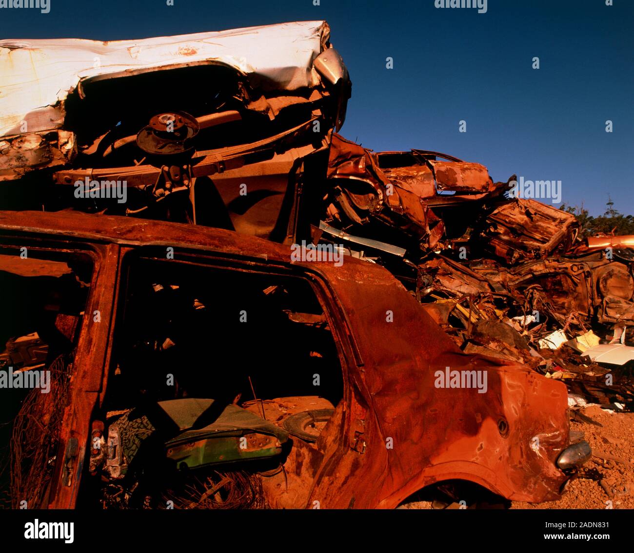 Rusting cars. A pile of rusting car bodies in a car scrap yard. Rusting ...