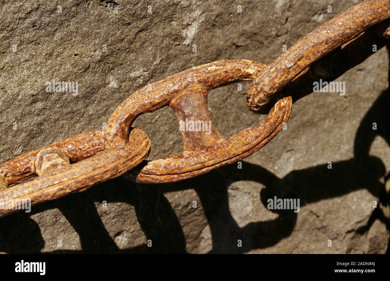 Rusting metal chain. Rusting is a chemical process in which iron reacts ...
