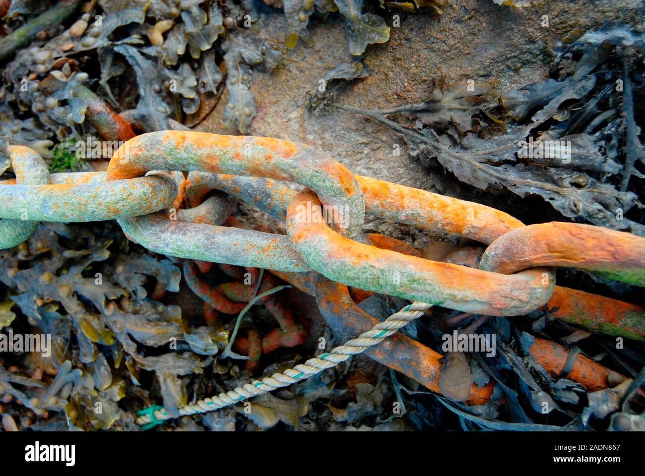 Rusted chain on a beach. Rusting (corrosion) is a chemical process in ...